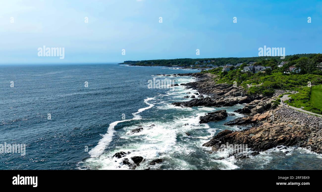 Aerial view of waves crashing over rocks near the Marginal Way running ...