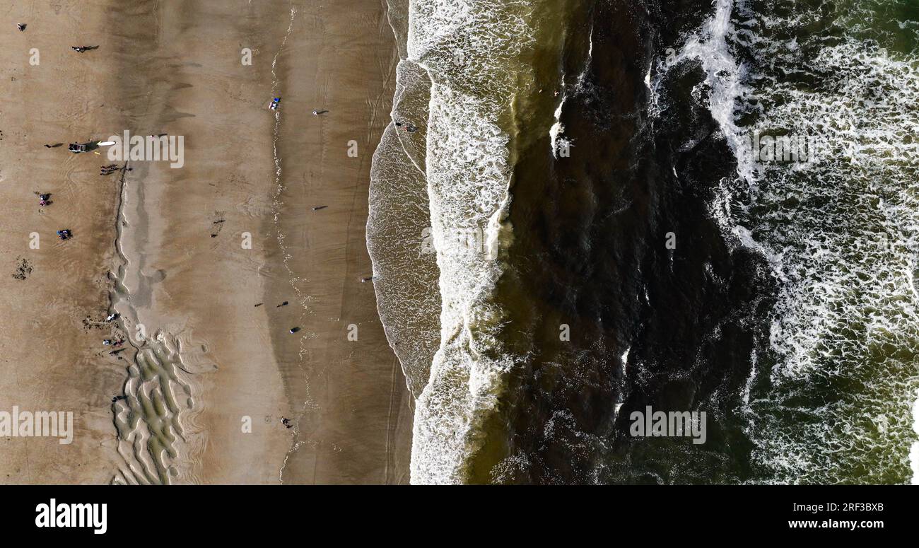 Aerial, split view of sand and water on Ogunquit Beach in Ogunquit ...
