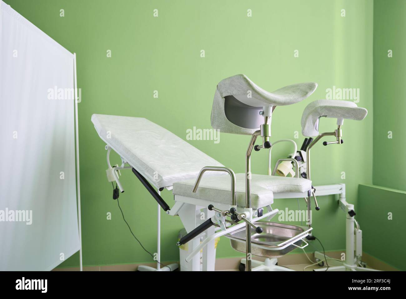 Gynecological examination chair in medical room Stock Photo - Alamy