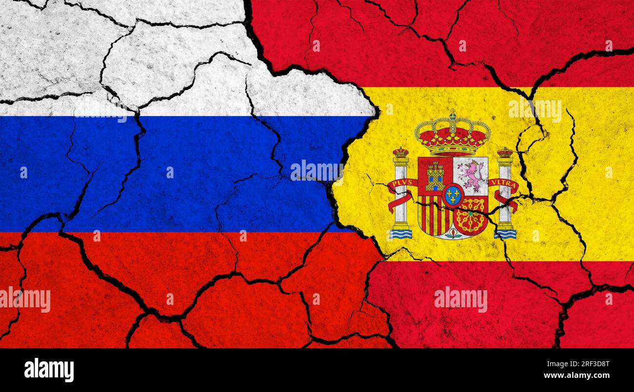 Flags of Russia and Spain on cracked surface - politics, relationship ...