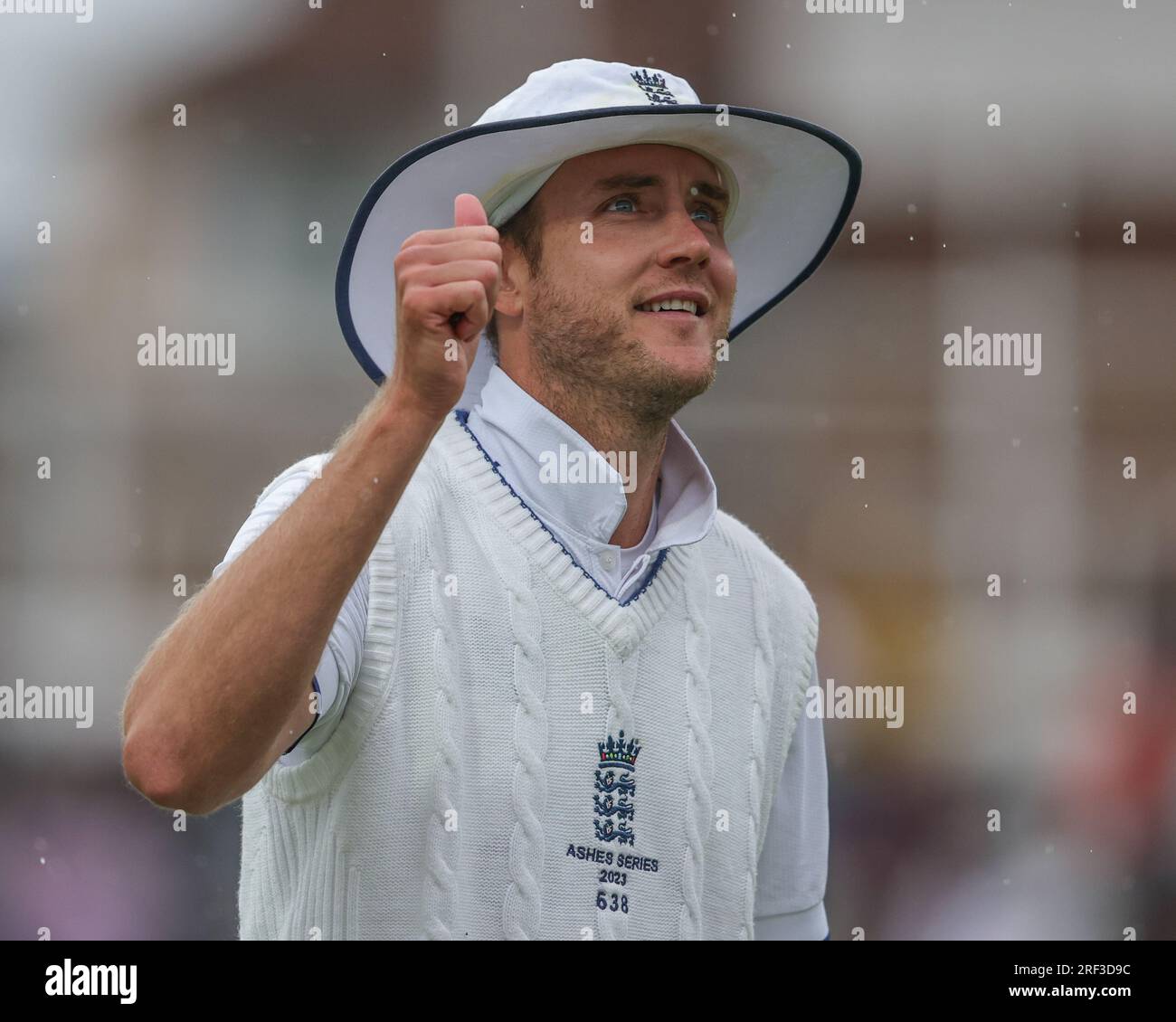 Stuart Broad of England gives a thumbs up to his partner and child up ...