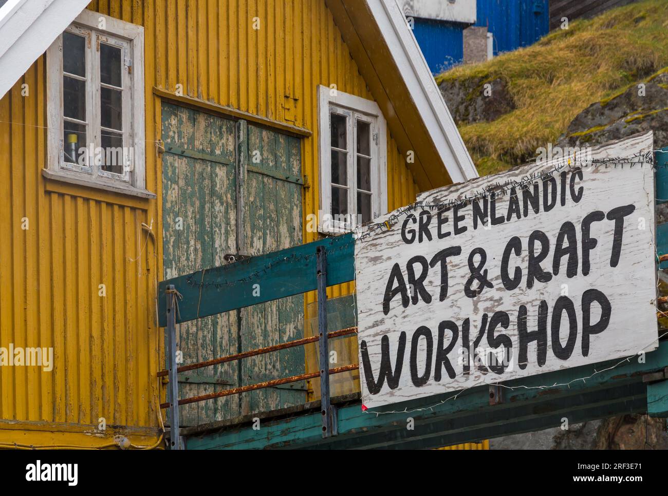 Greenlandic Art & Craft Workshop sign at Sisimiut, Greenland on a wet ...