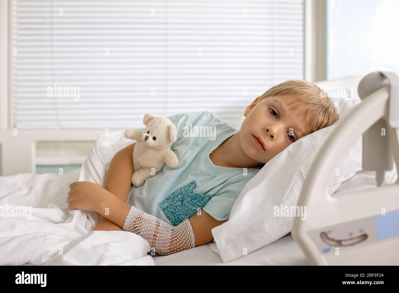 Little preschool child, lying in hospital after accident, mother ...