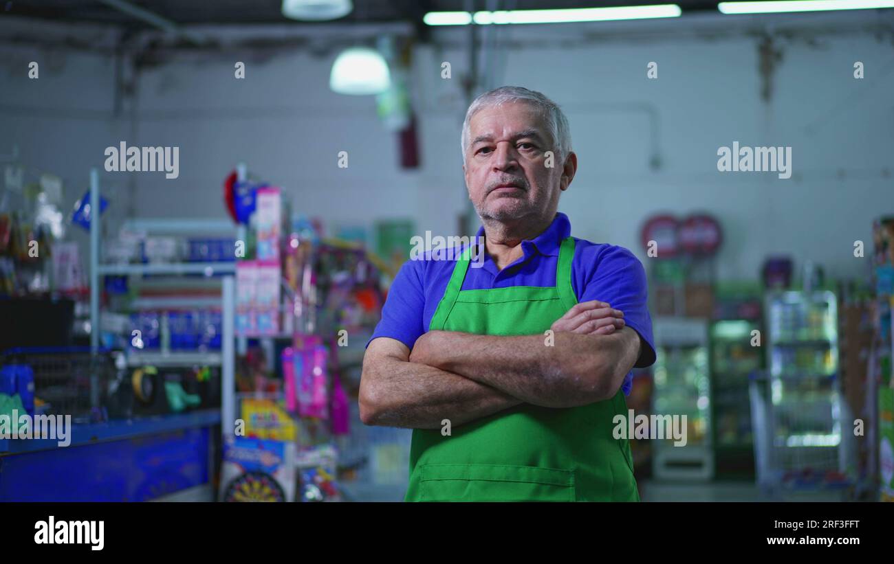 Serious Supermarket Manager with Arms Crossed, Concerned Expression of ...