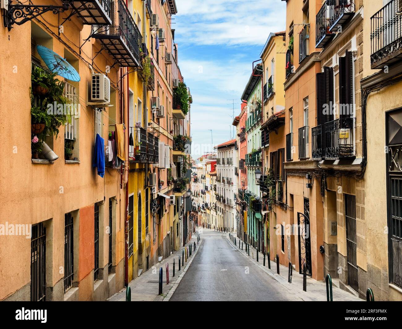Street in old Madrid downtown with colorful typical houses Stock Photo ...
