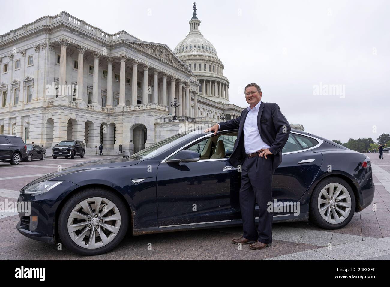 Rep. Thomas Massie (R-Ky.) is seen with his Tesla Model S electric ...