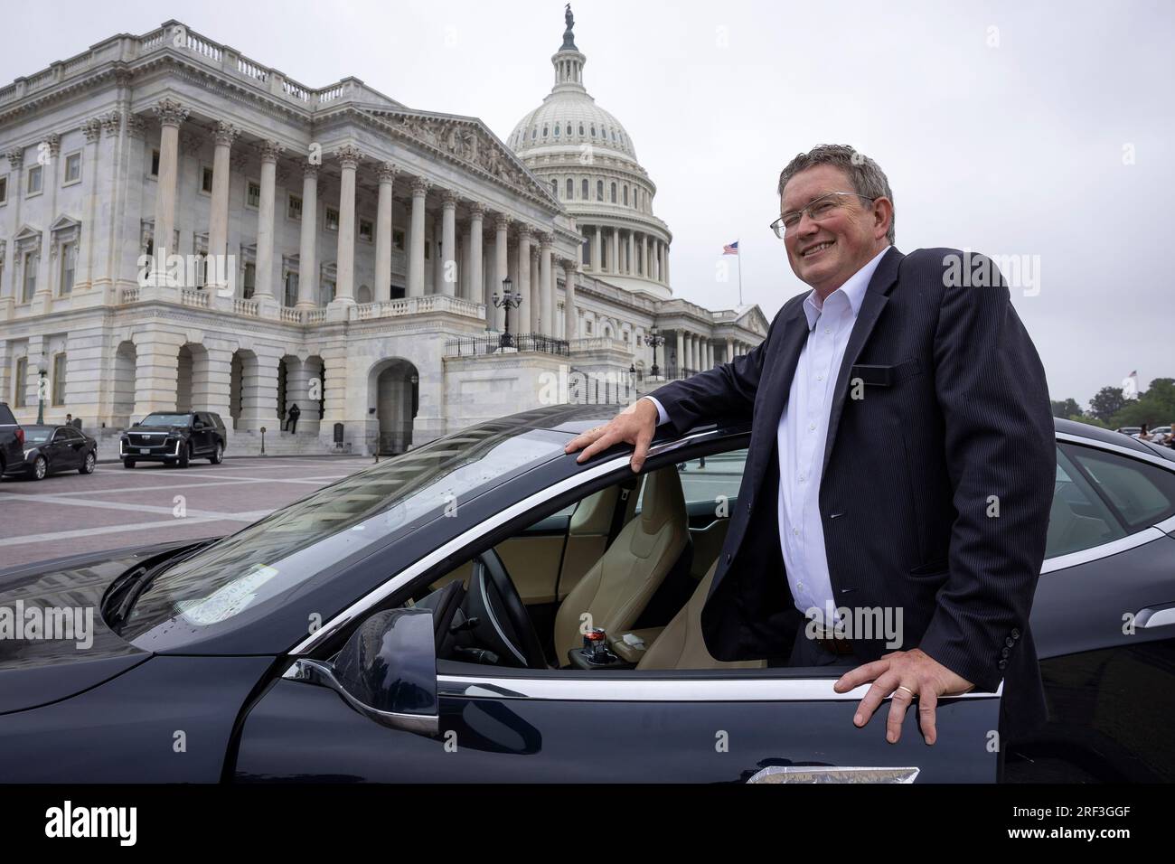 Rep. Thomas Massie (R-Ky.) is seen with his Tesla Model S electric ...
