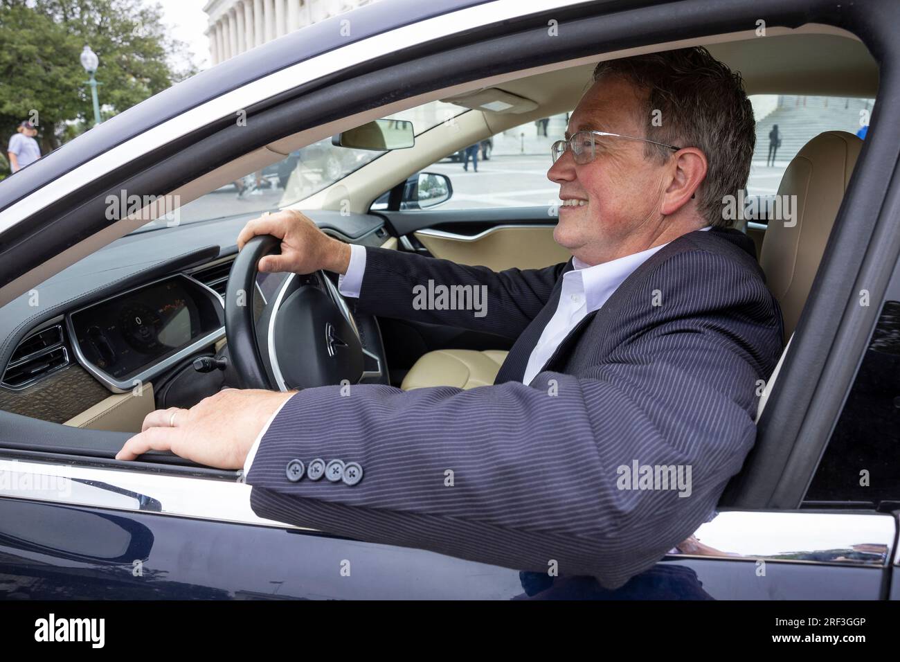 Rep. Thomas Massie (R-Ky.) is seen in the driver's seat of his Tesla ...