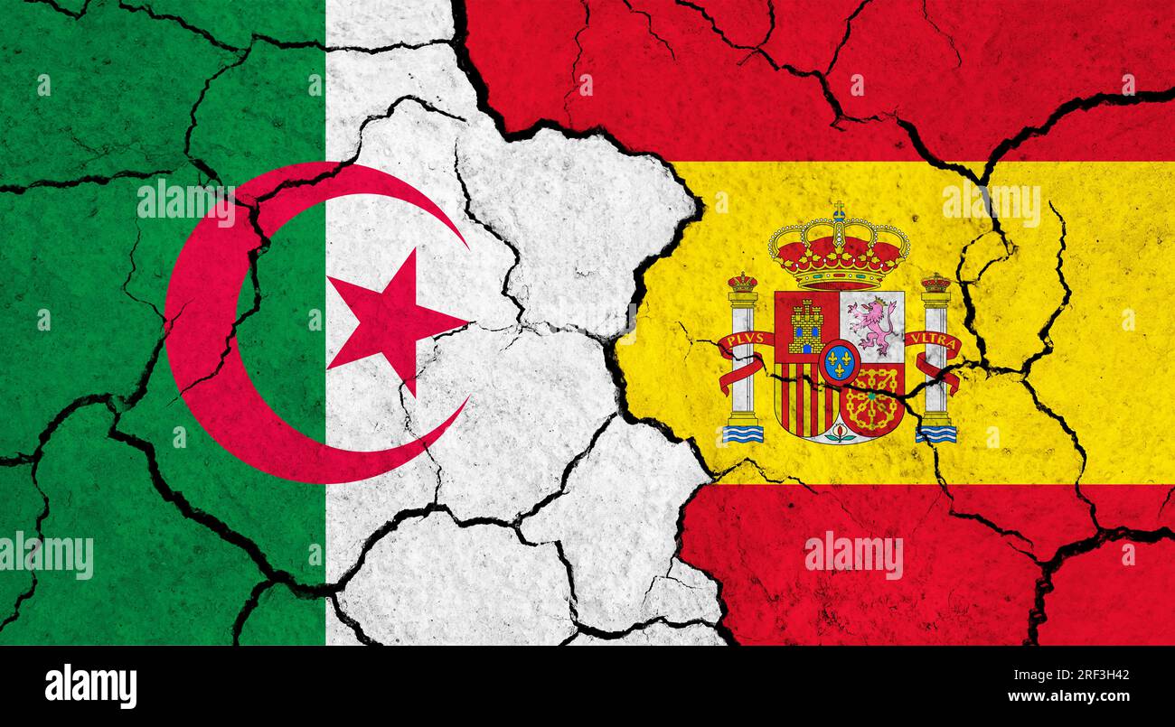 Flags of Algeria and Spain on cracked surface - politics, relationship ...