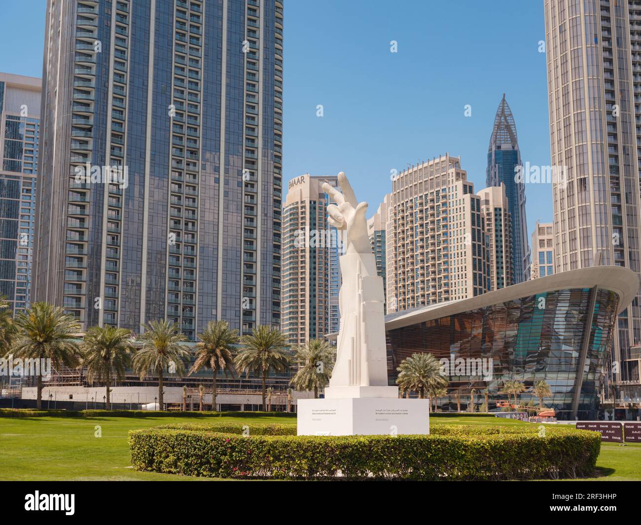 23 March 2023, Dubai, UAE: three fingers statue near Burj Khalifa in ...