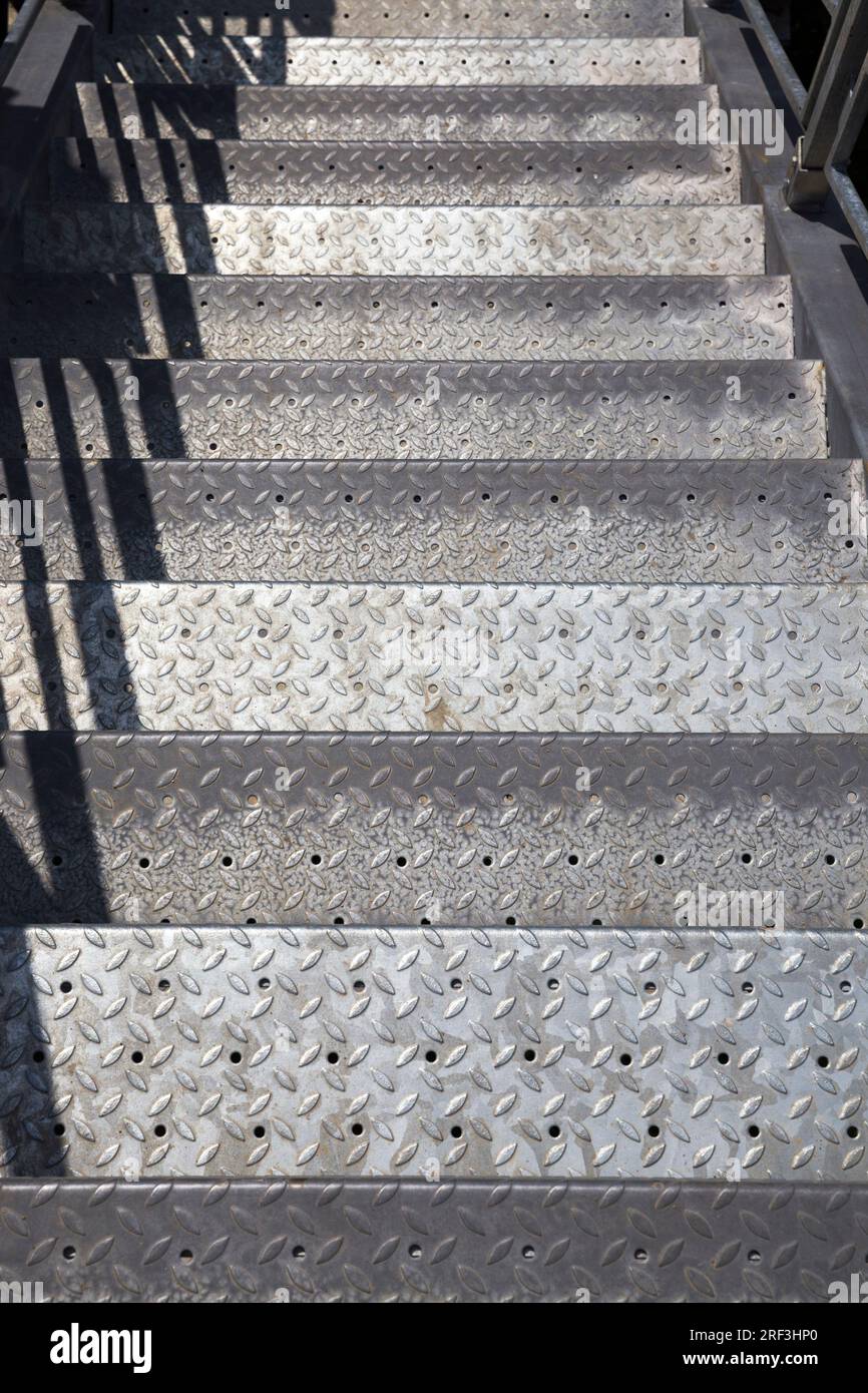 steel metal ladder made of strong metal and has an uneven structure of ...