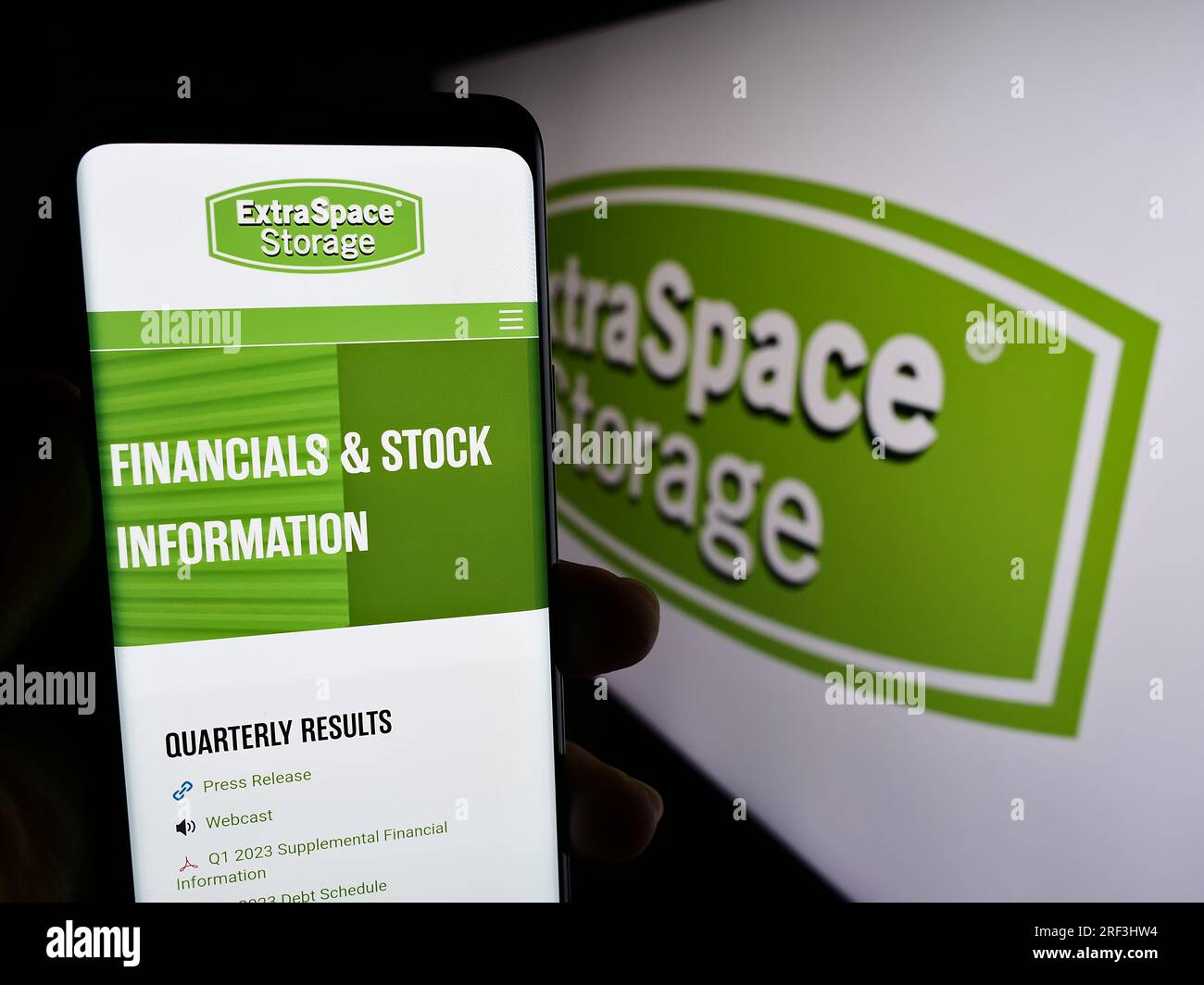 Person holding smartphone with website of US company Extra Space ...