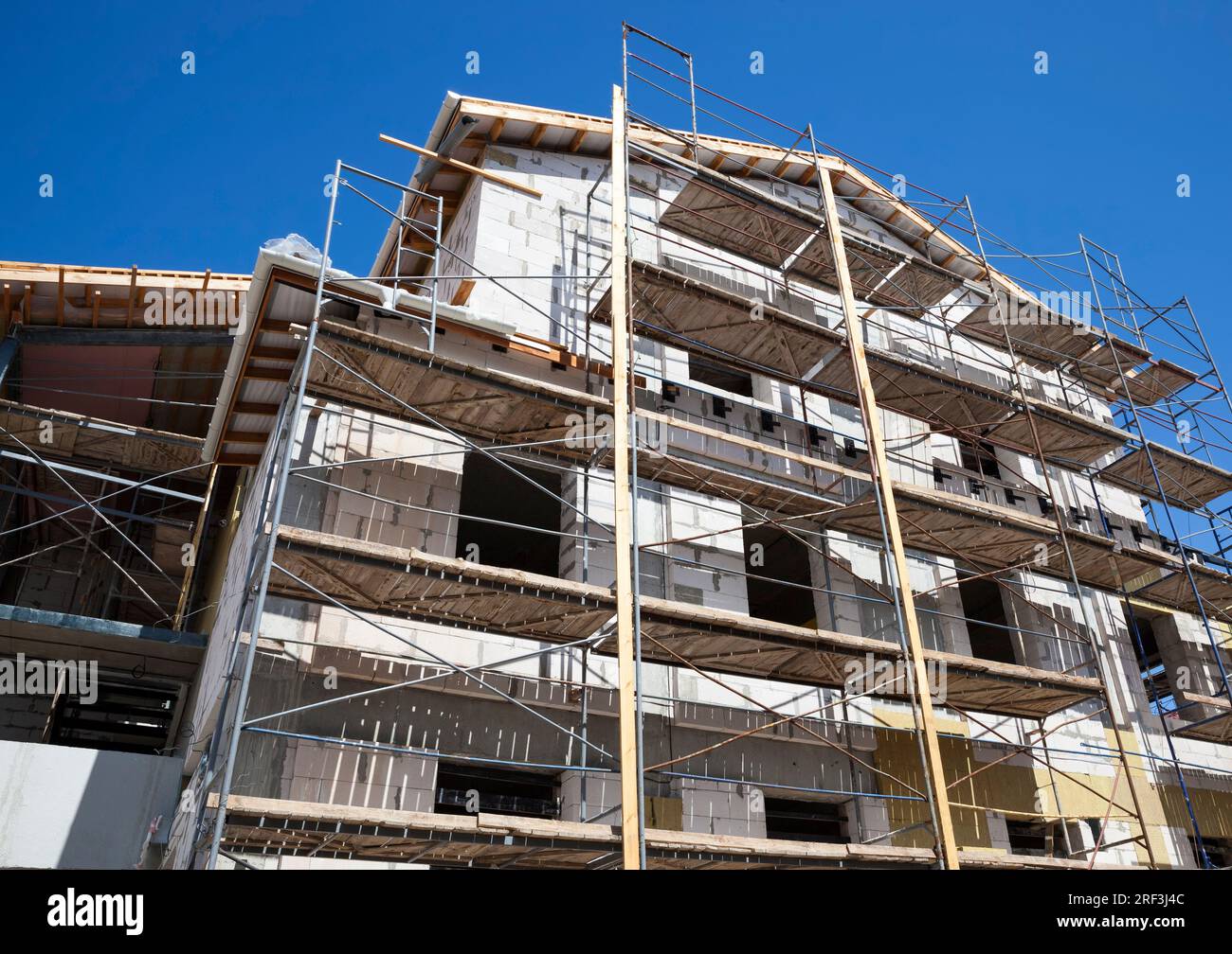 building a new home on the building scaffolding for construction and ...