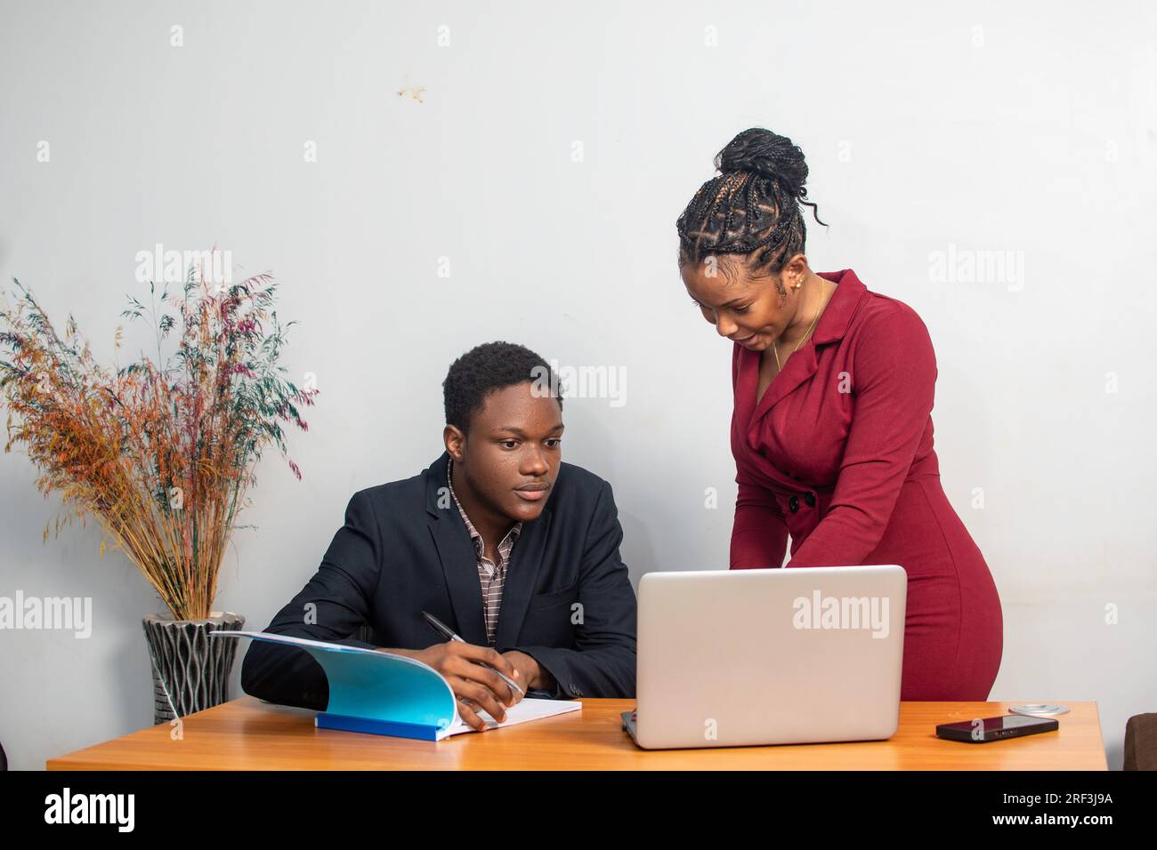 two african employees working together Stock Photo - Alamy