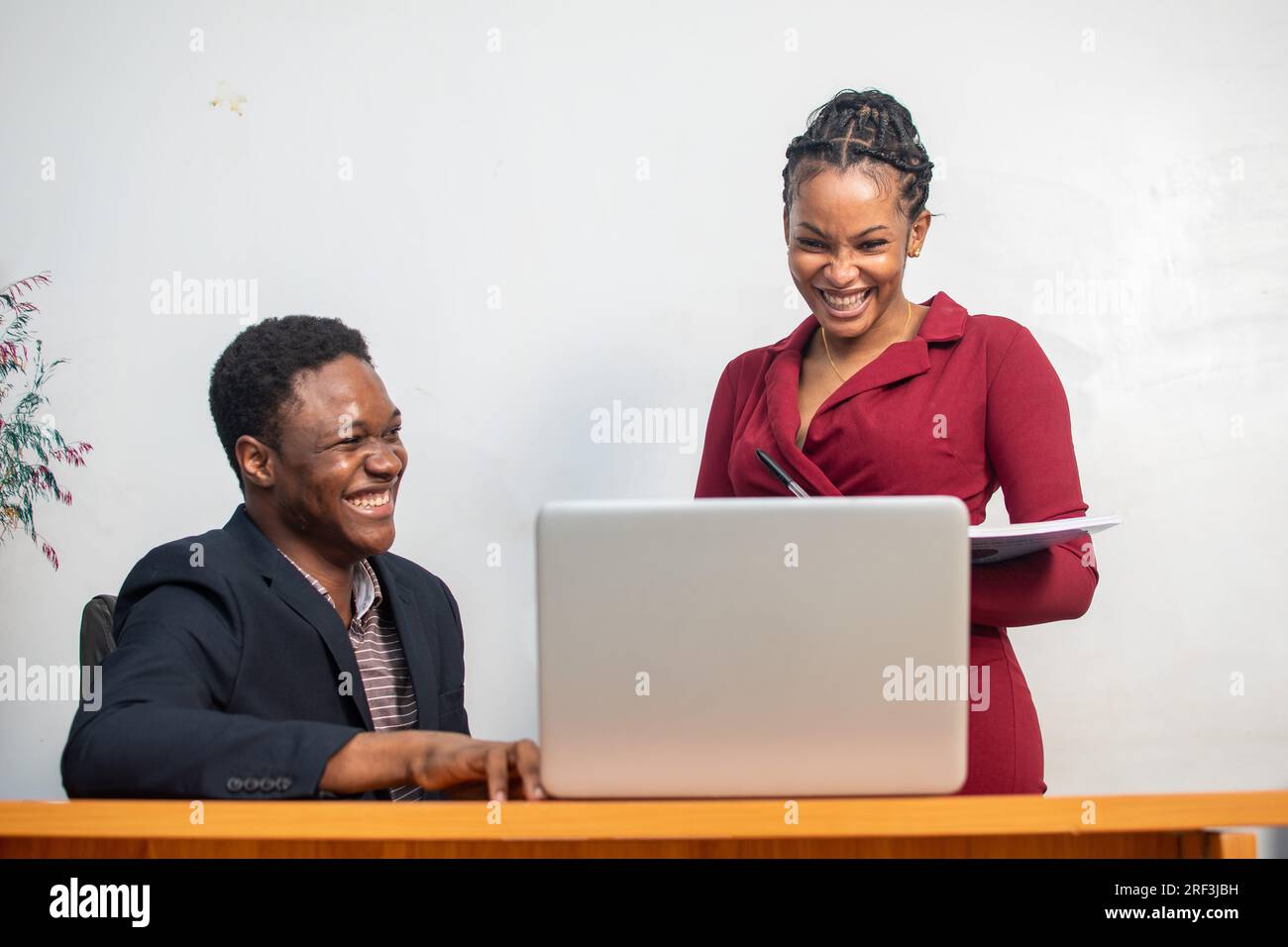 two african employees working together on a project Stock Photo - Alamy