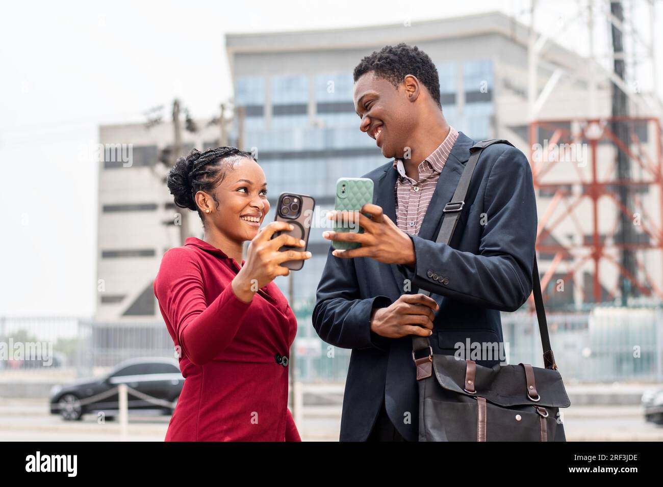 African woman laughing text message hi-res stock photography and images ...