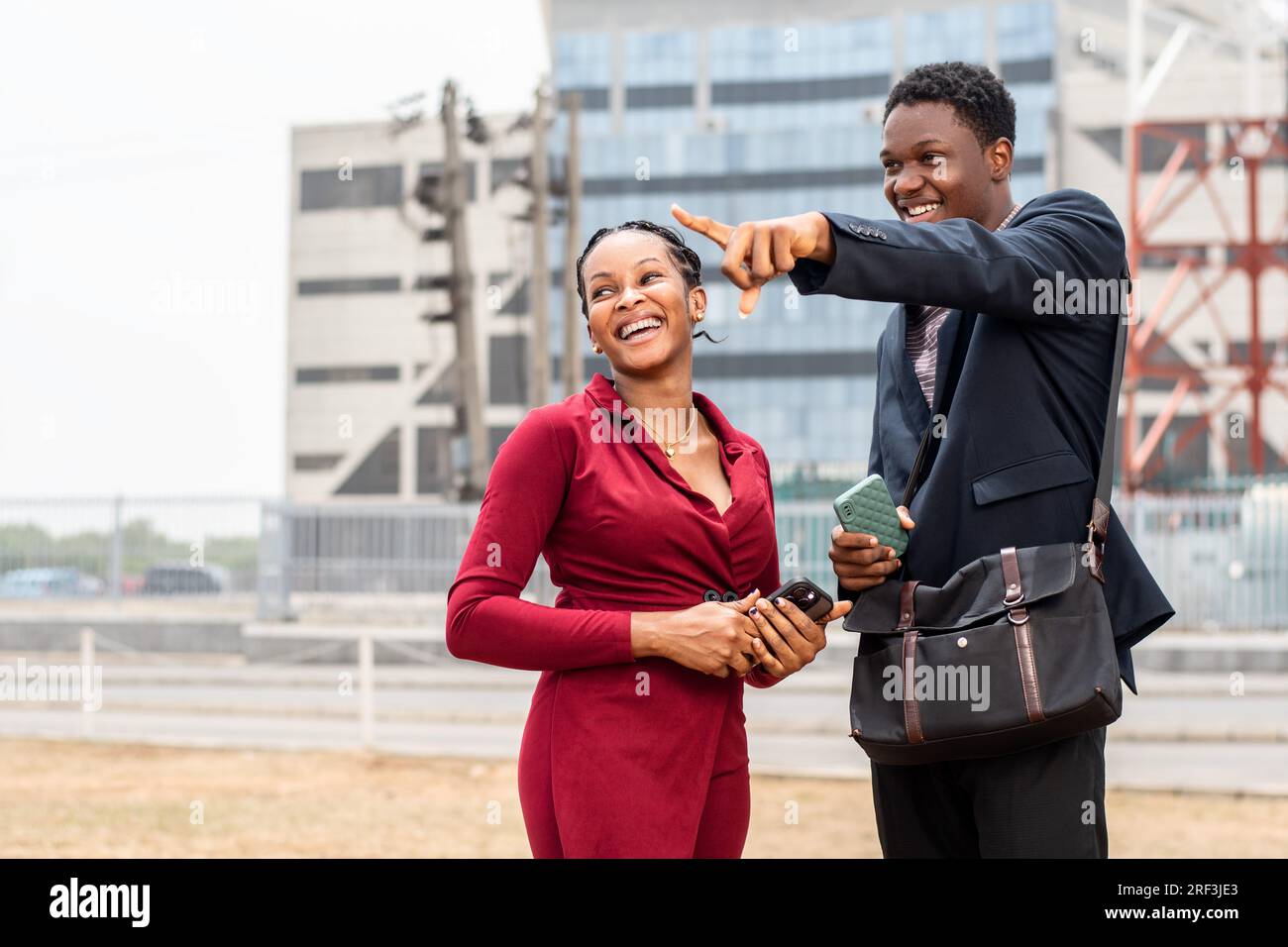 african businessman giving a lady directions Stock Photo - Alamy