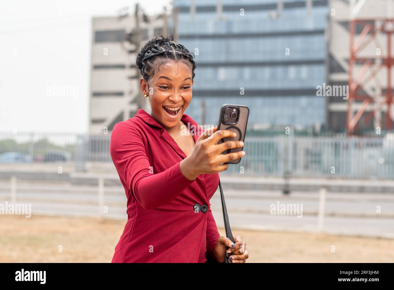 Surprised lady checking mobile phone hi-res stock photography and ...