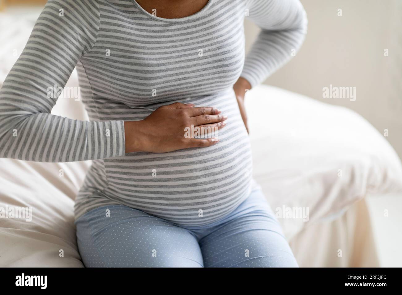 Unrecognizable Black Pregnant Lady Having Acute Pain, Touching Back And ...