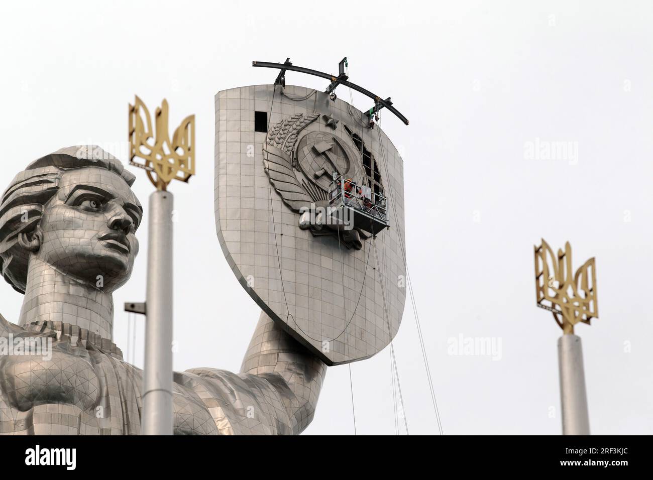 KYIV, UKRAINE - JULY 31, 2023 - Two flagpoles crowned by the coat of ...