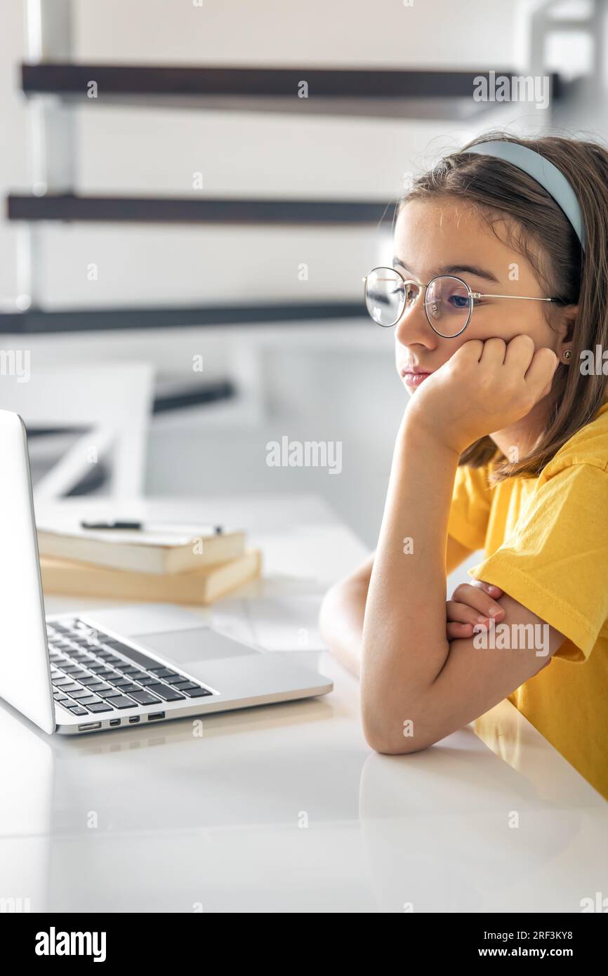 Exhausted schooler girl suffering from doing homework, tired from ...