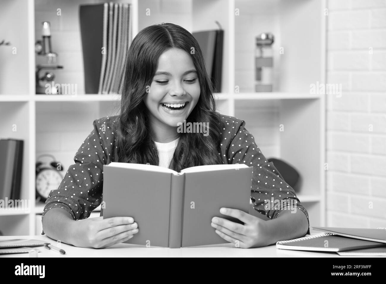 Back to school. Teenager school girl reading book ready to learn. Happy ...