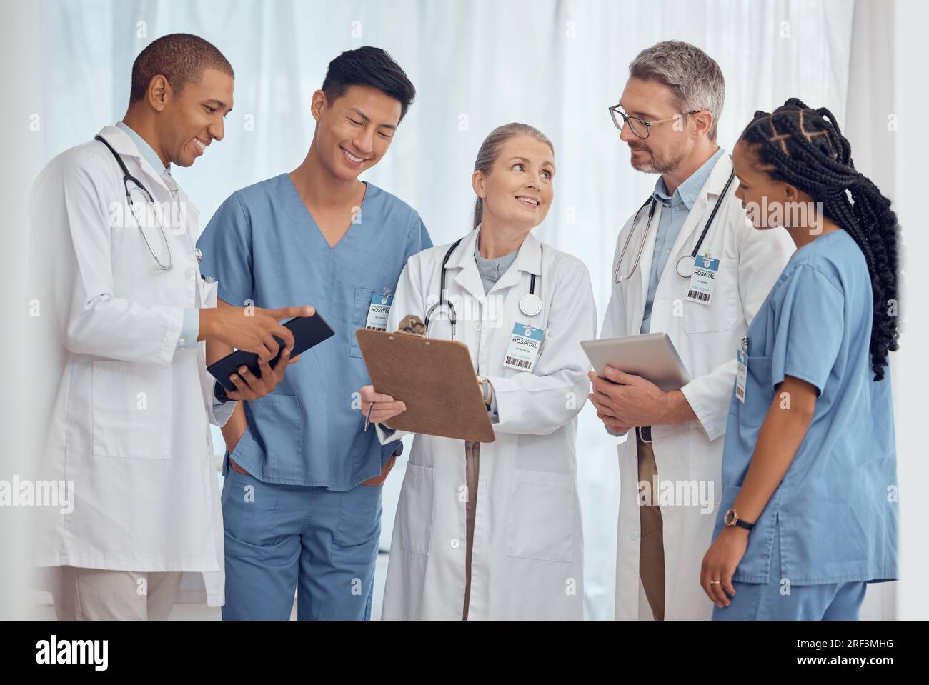 Group of happy doctors, nurses and checklist in hospital, meeting and ...