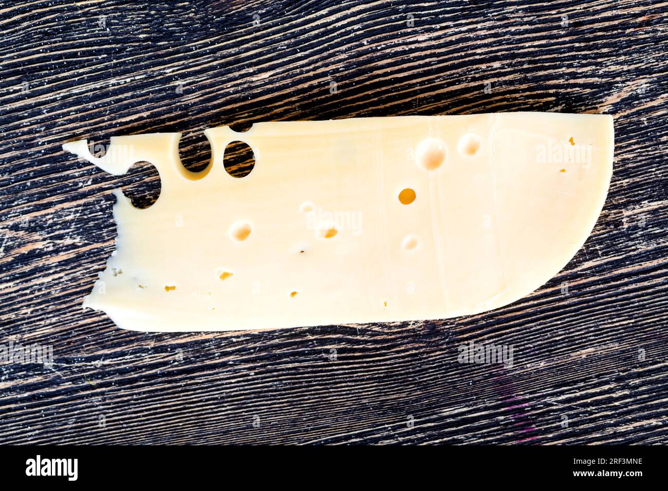 cut into pieces delicious ready made cheese with lots of holes, healthy ...