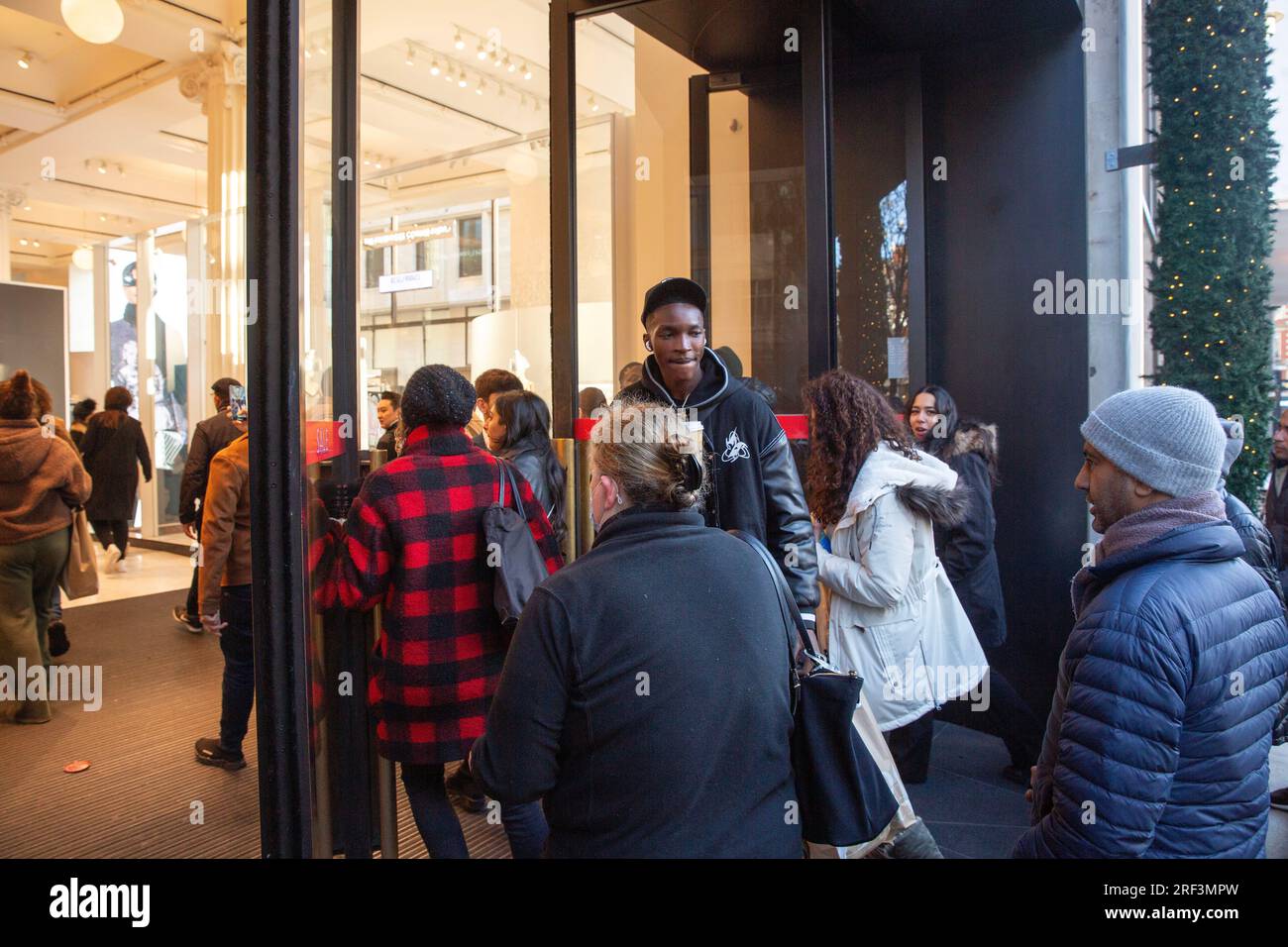 People enter Selfridges store on Oxford Street in London, at the ...