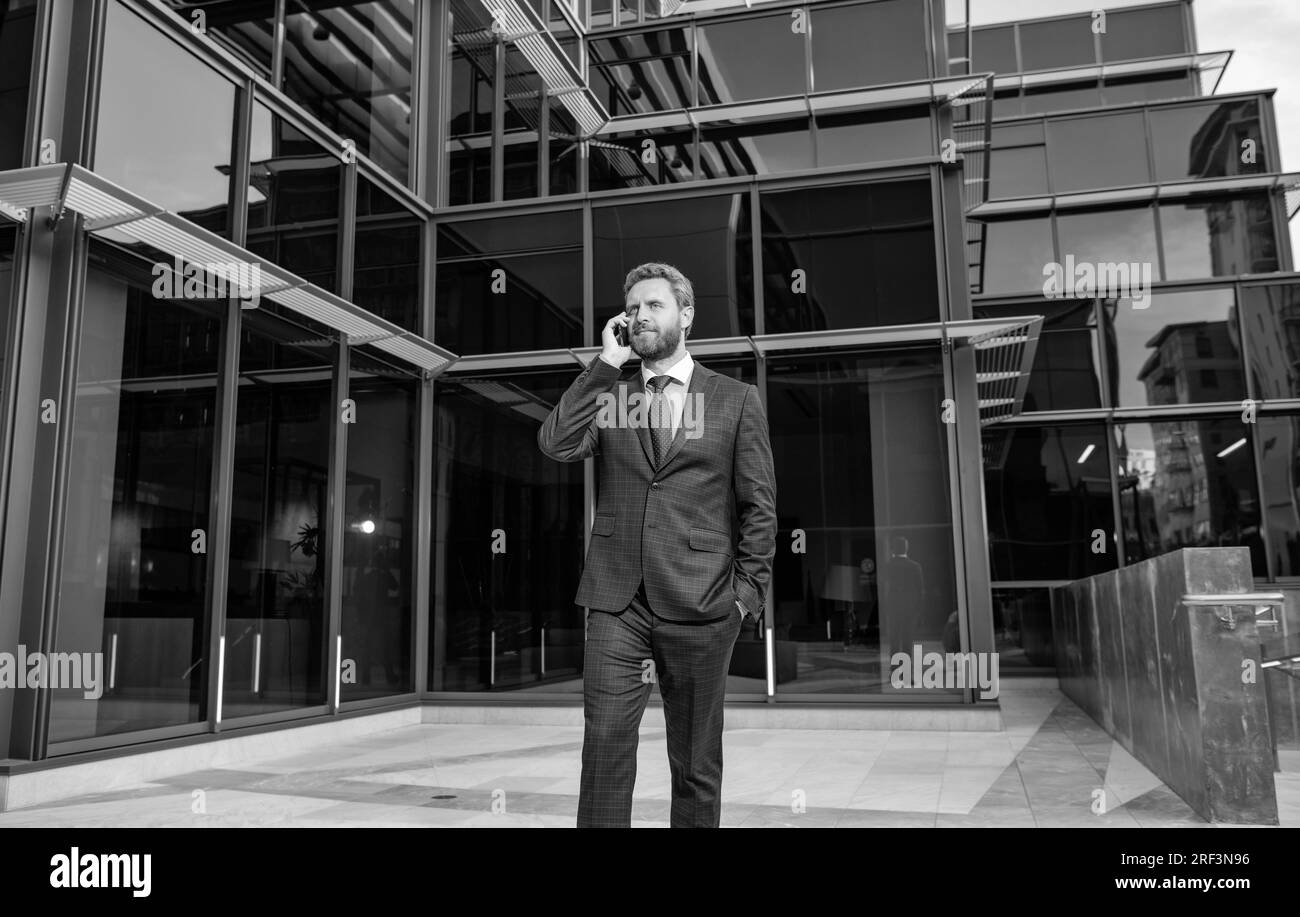 communication. businessman speak on smartphone outside the office Stock ...