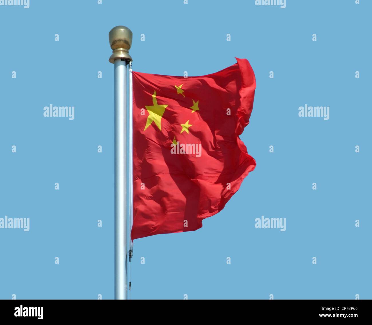 chinese flag in front of blue sky Stock Photo - Alamy