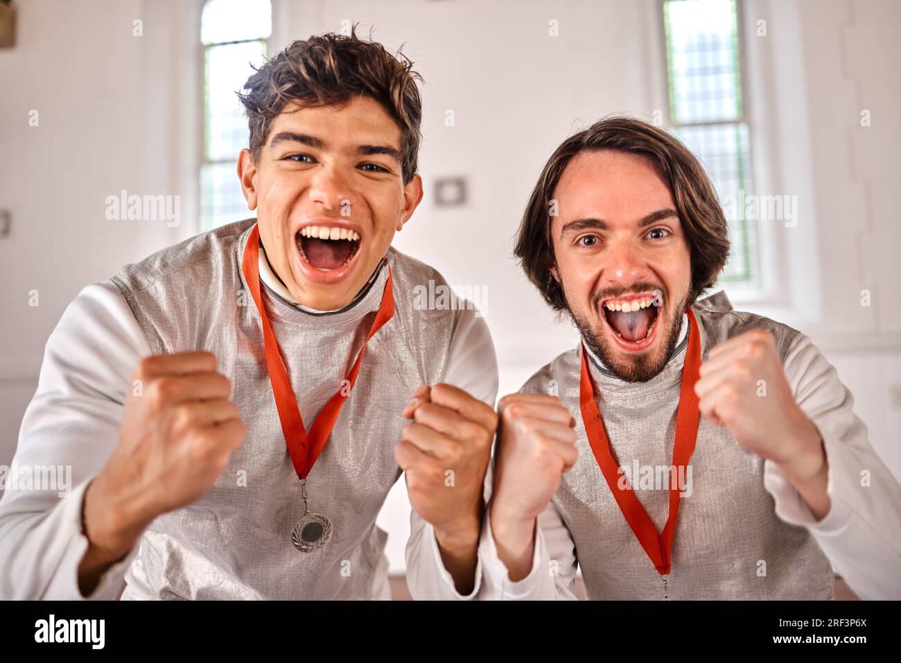 Team, portrait or men winning a medal for a fighting competition ...