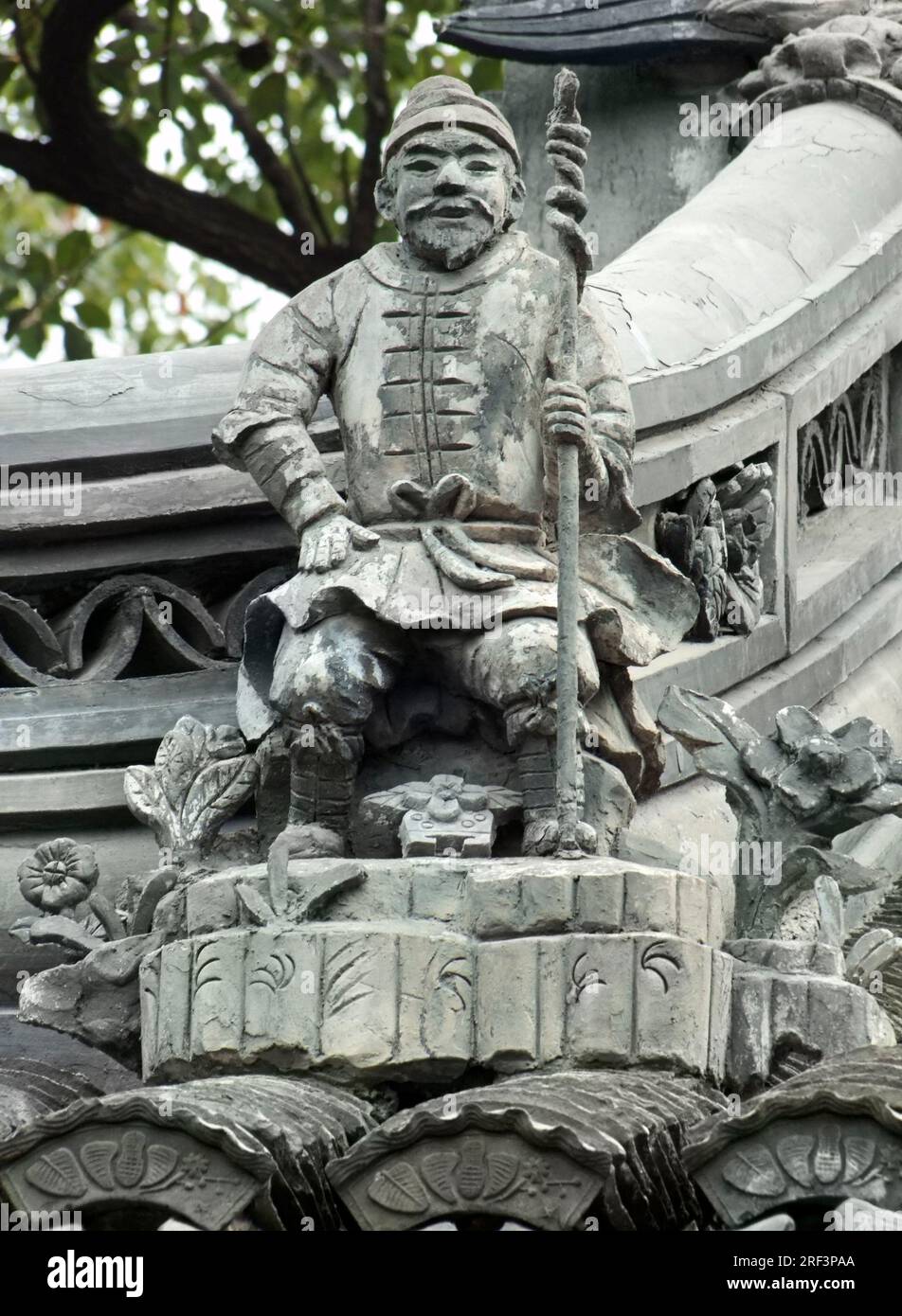 architectural detail including a historic stone sculpture at the Yuyuan ...