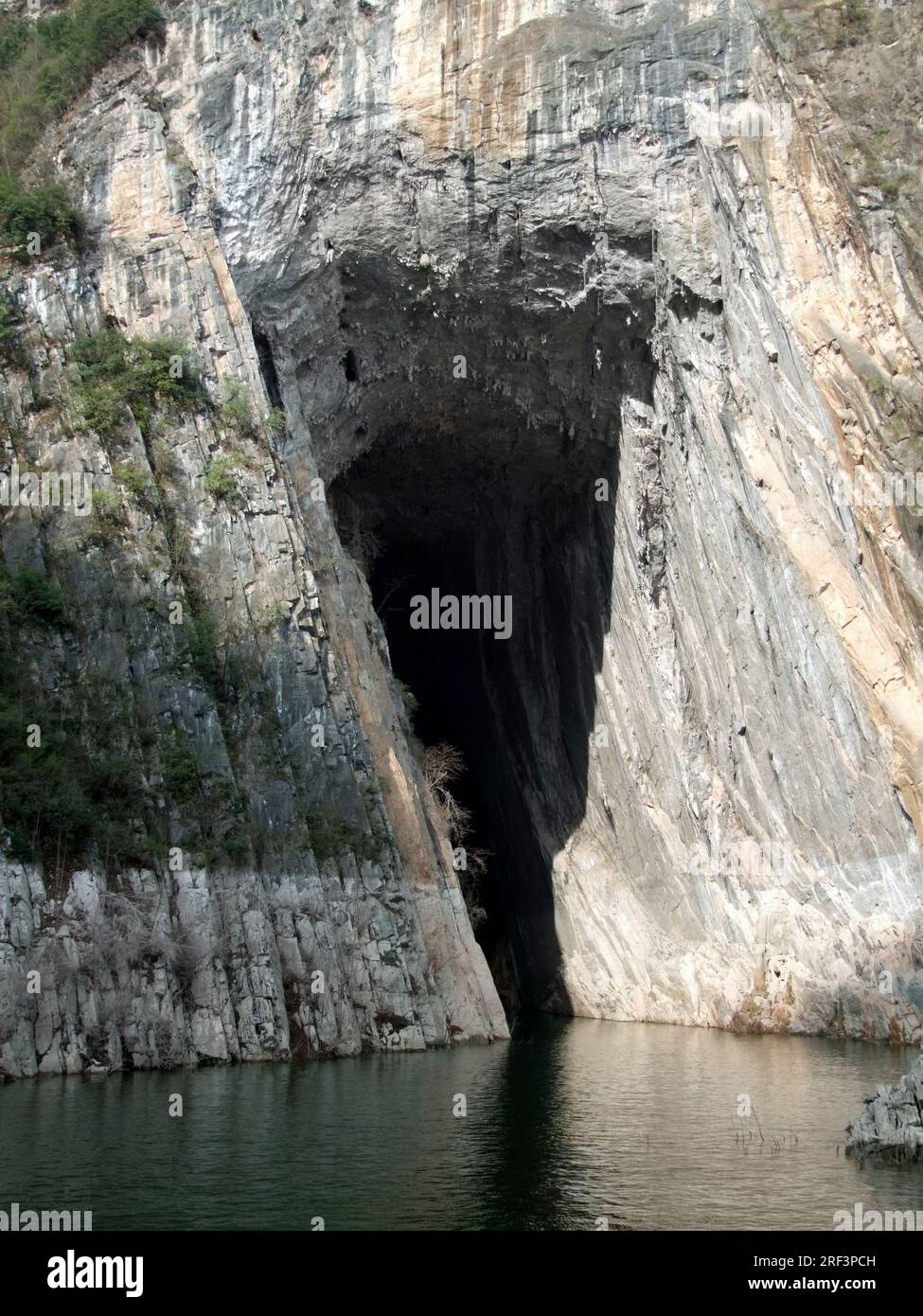 scenery around River Shennong Xi in China including a grotto and rock ...