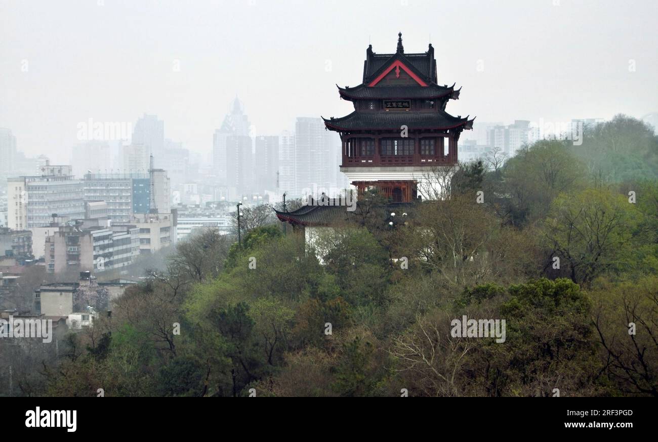 traditional building in front of the skyline of Wuhan, a big city in ...