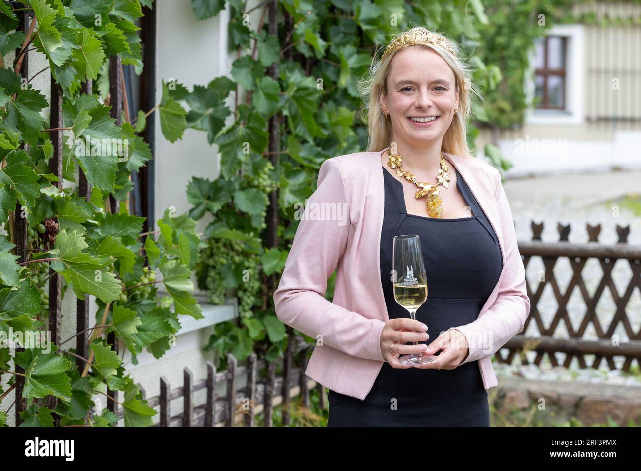 31 July 2023, Saxony, Meißen: Saxon Wine Queen Sabrina Schreiber stands ...