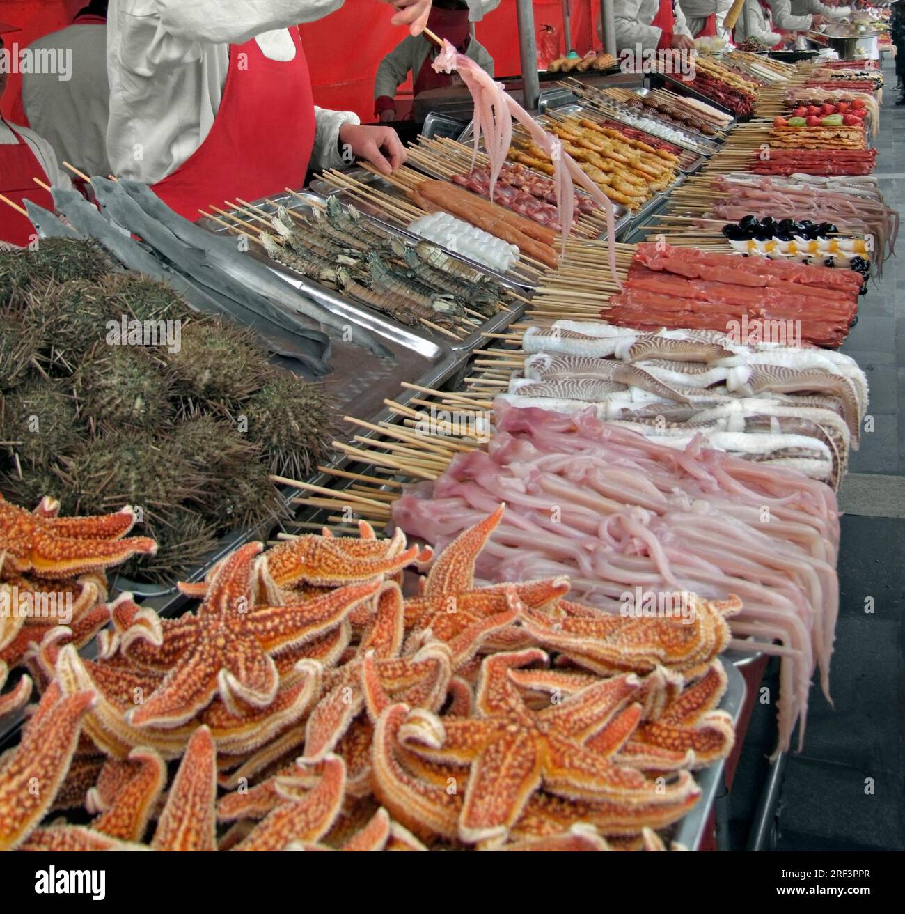 detail of a chinese market stall with lots of strange food in Beijing ...