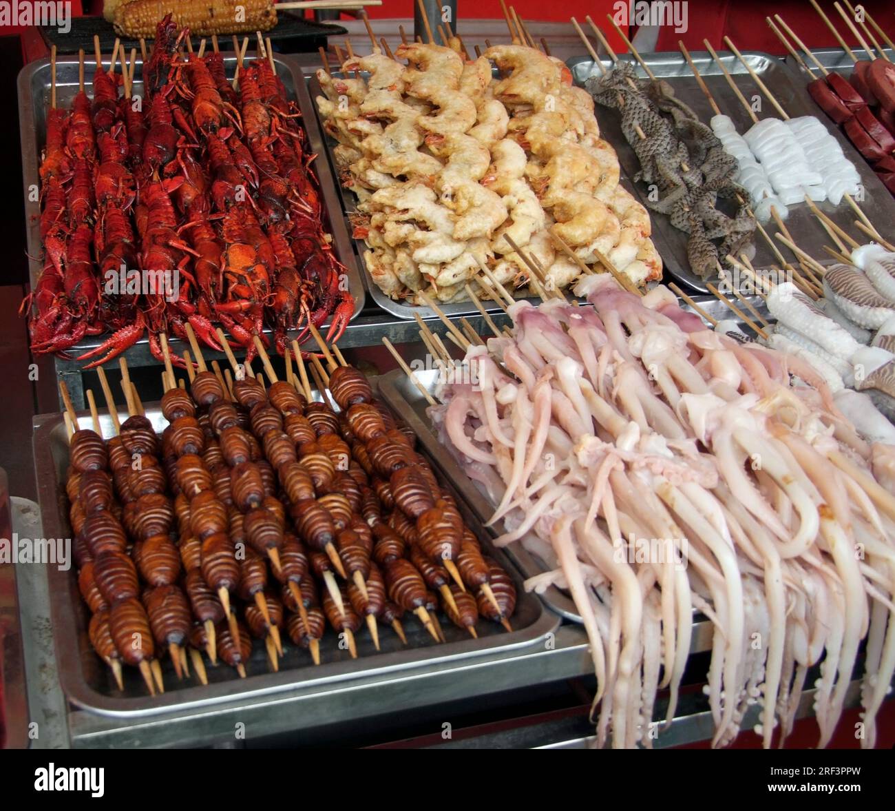 detail of a chinese market stall with lots of strange food in Beijing ...