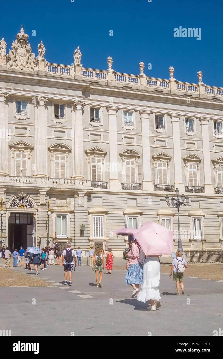 Tourists walking towards the Palace at the Plaza de Oriente – East ...