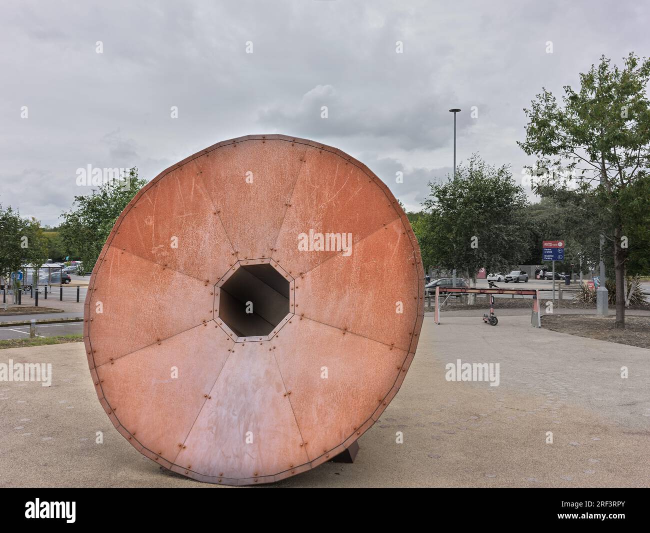 Rusty modern sculpture made of iron, outside Tesco supermarket, a ...