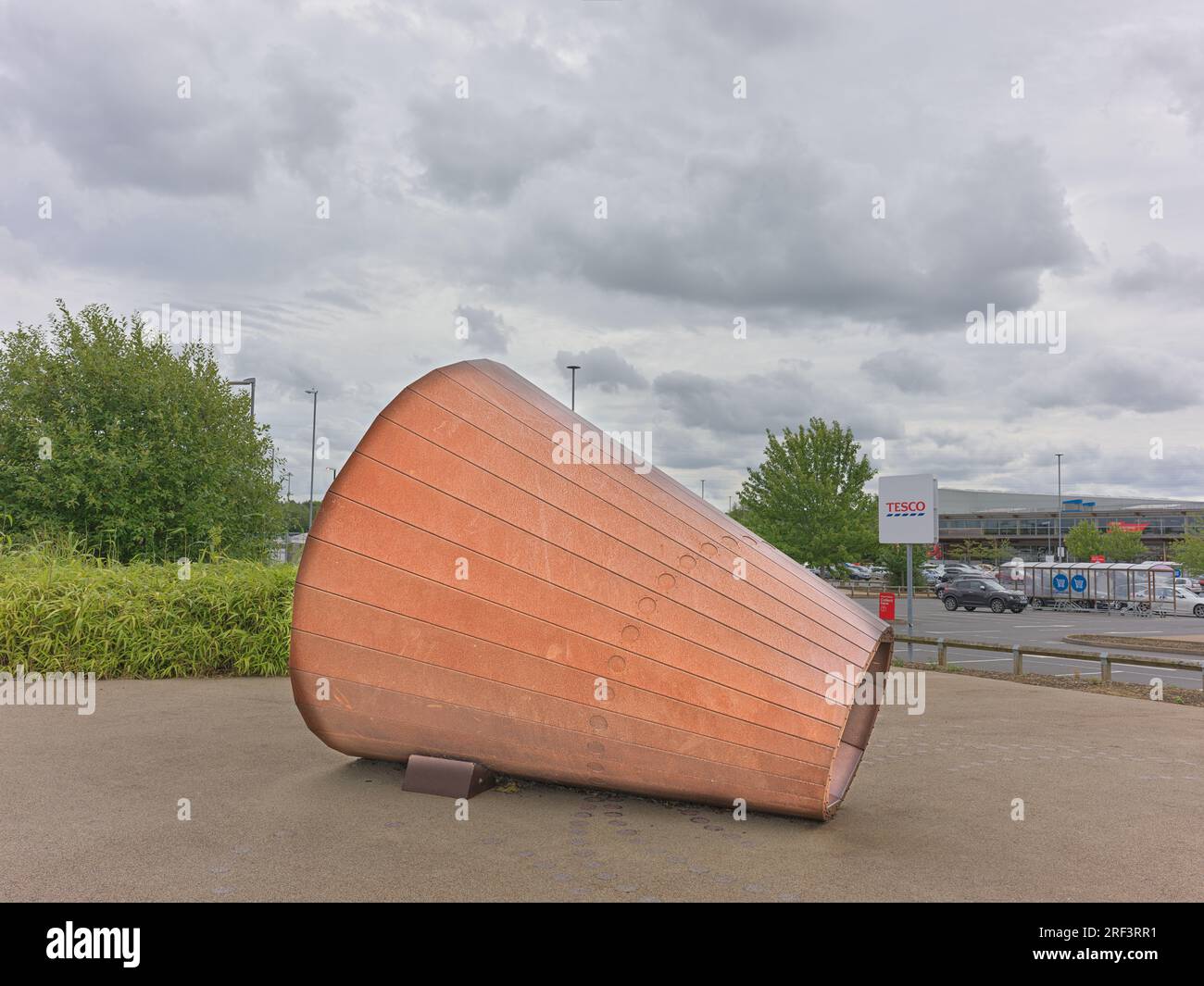 Rusty modern sculpture made of iron, outside Tesco supermarket, a ...