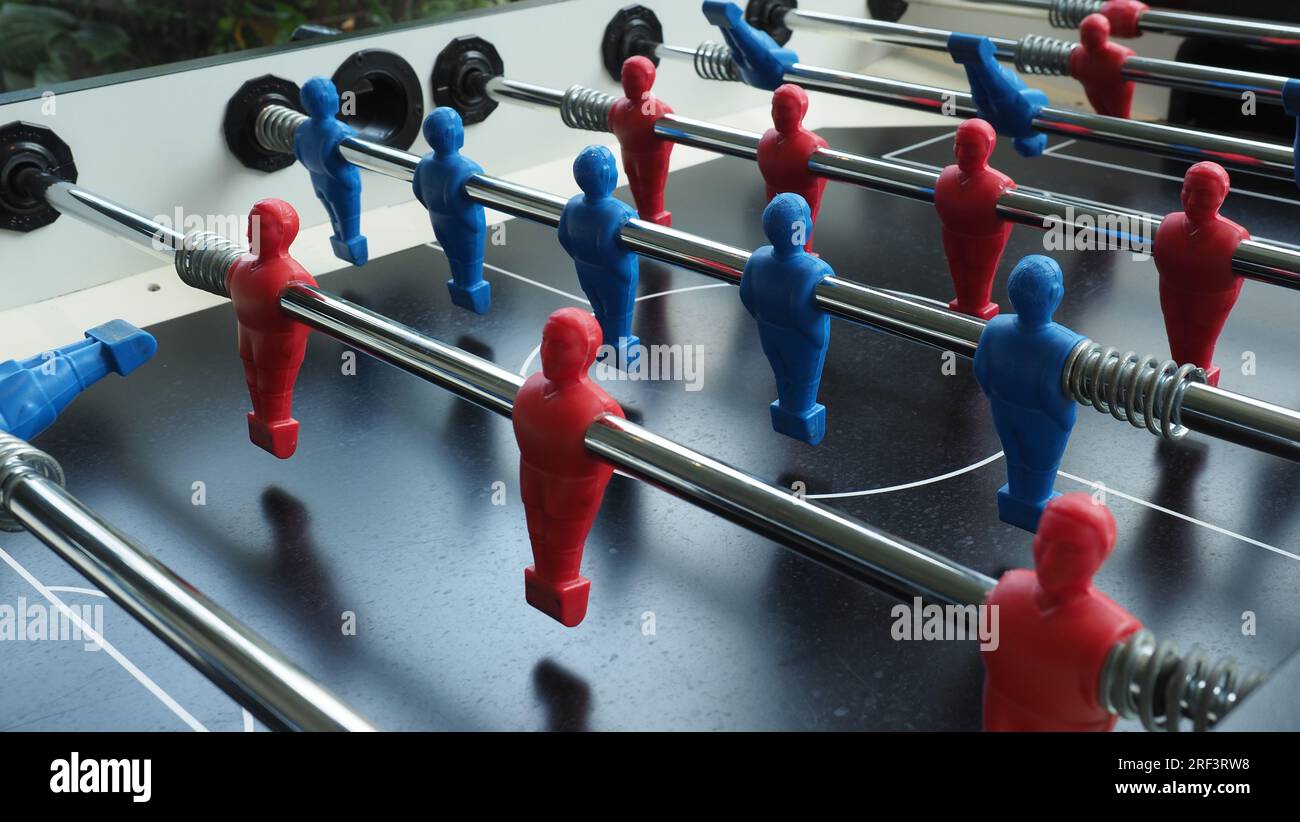 Football table or soccer table game with plastic player figurine. Mini ...