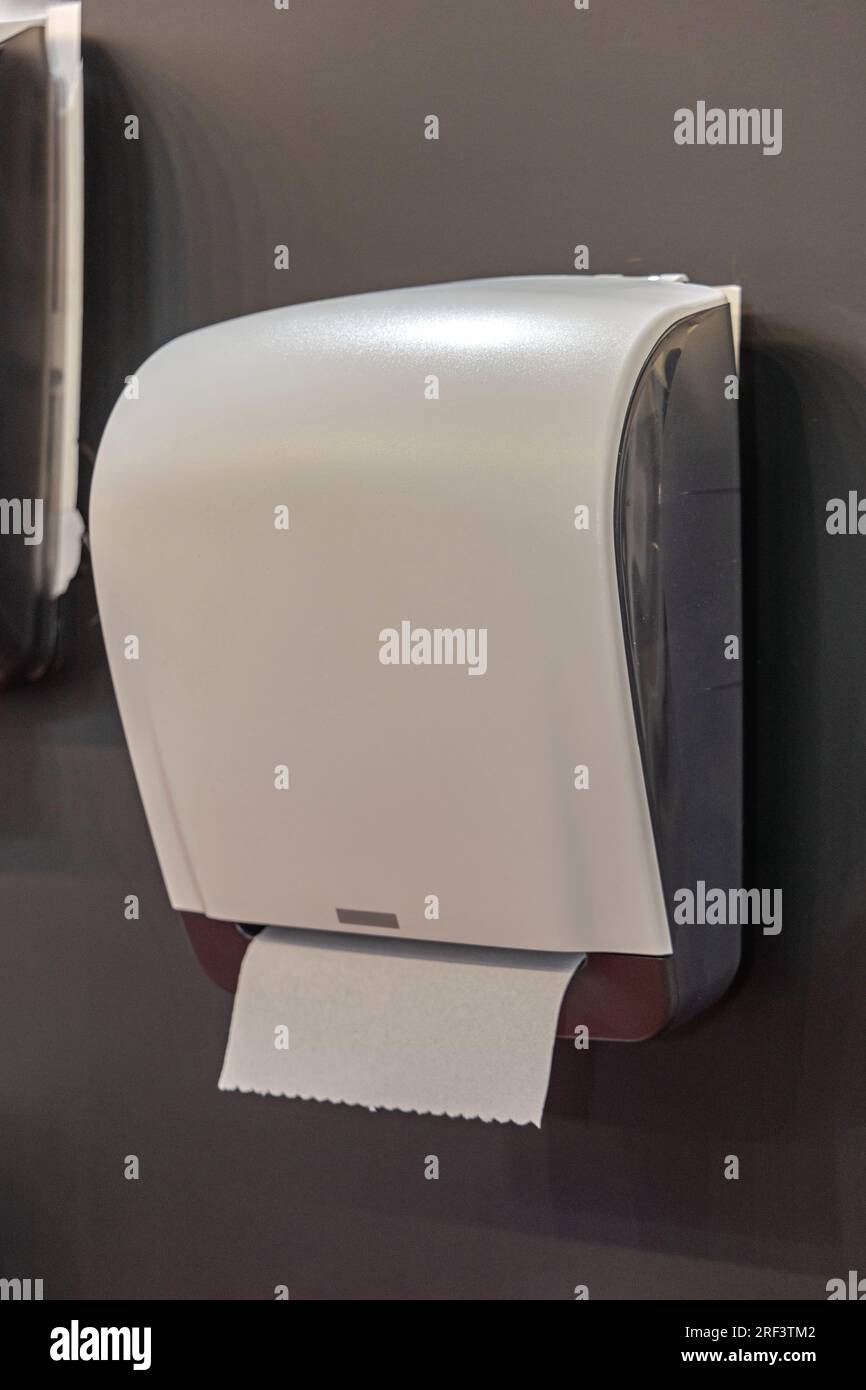 White Plastic Box Hand Paper Towel Dispenser at Black Wall Stock Photo ...