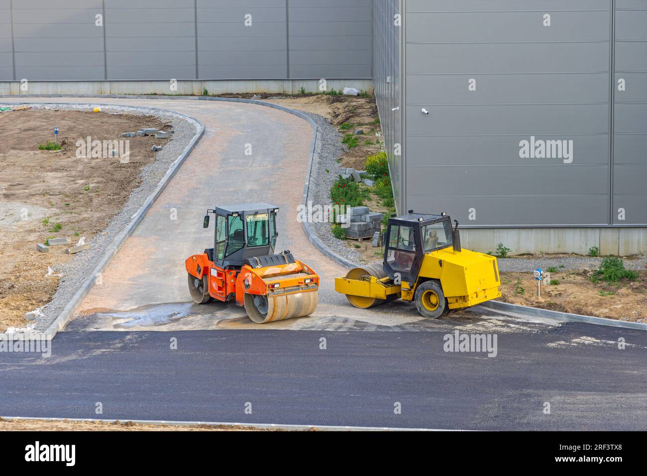 Two Road Rollers at Construction Site New Factory Building Stock Photo ...