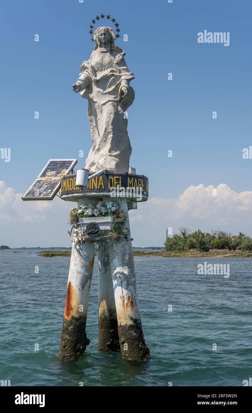 Our Lady votive statue on briccola poles in lagoon, shot in bright ...