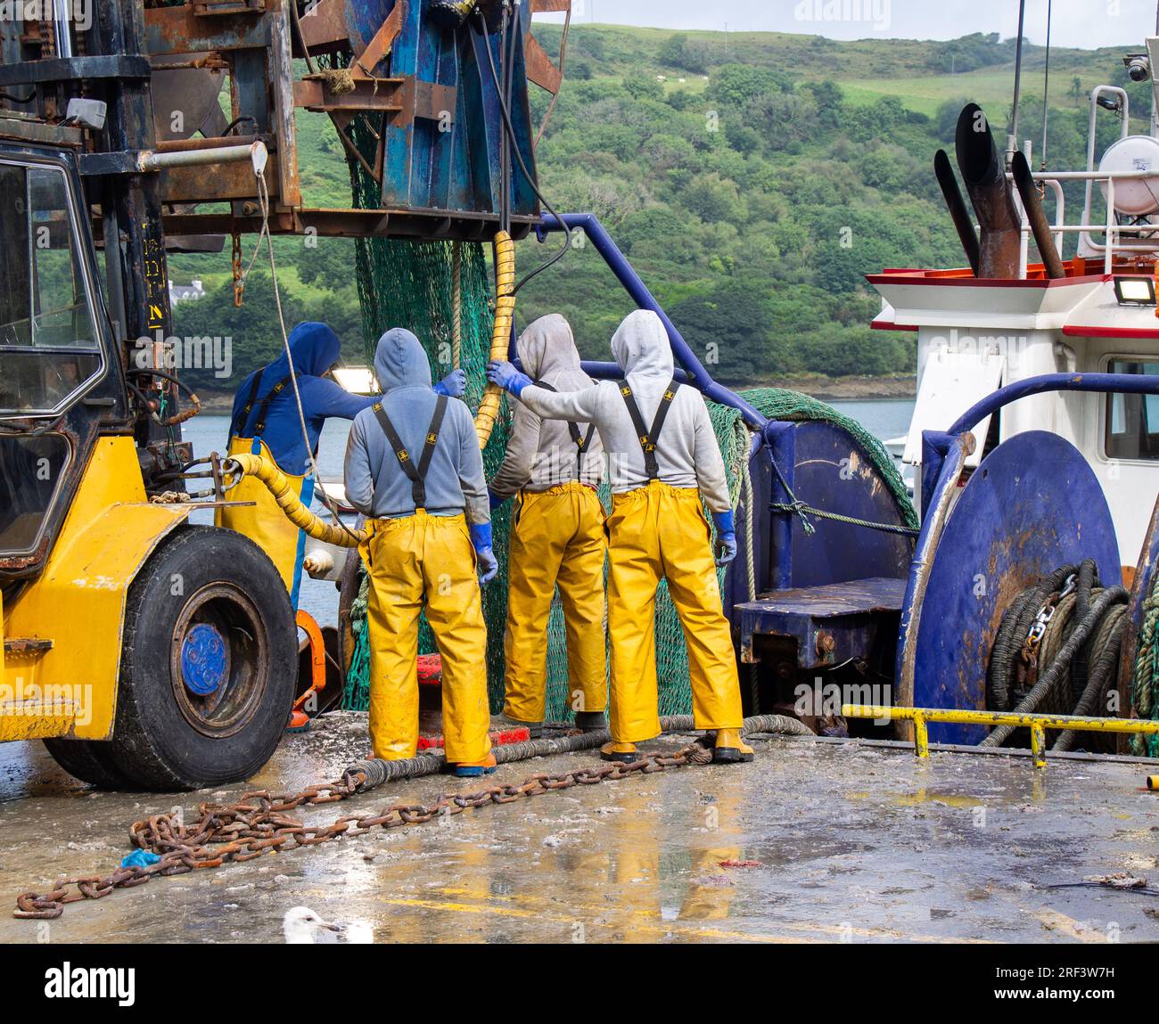Trawler crew loading nets hi-res stock photography and images - Alamy