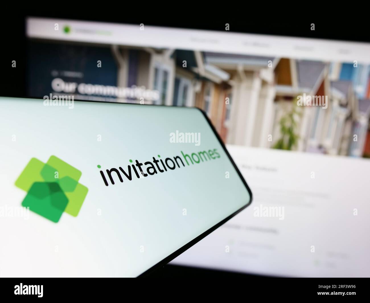 Mobile phone with logo of US real estate company Invitation Homes Inc ...