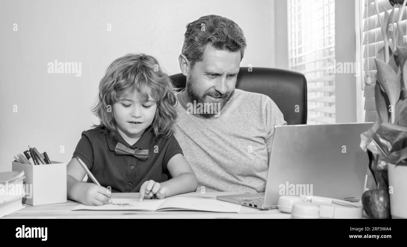 homeschooling and elearning. back to school. father and son use ...