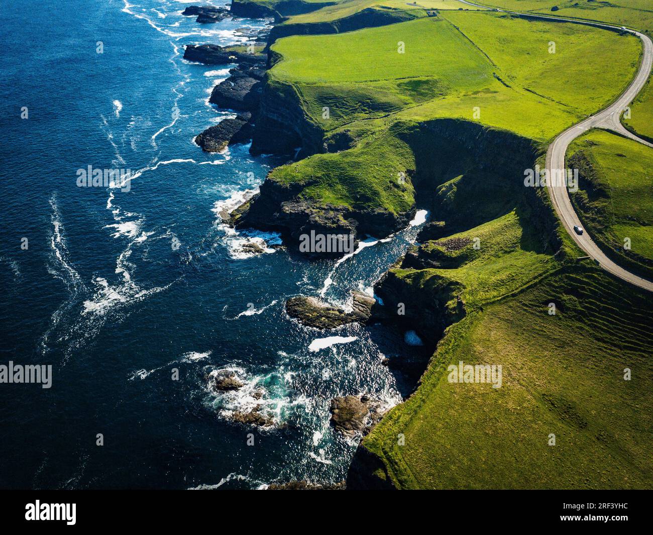 Aerial views of a winding coastal road, North Coast, Causeway, Coast ...