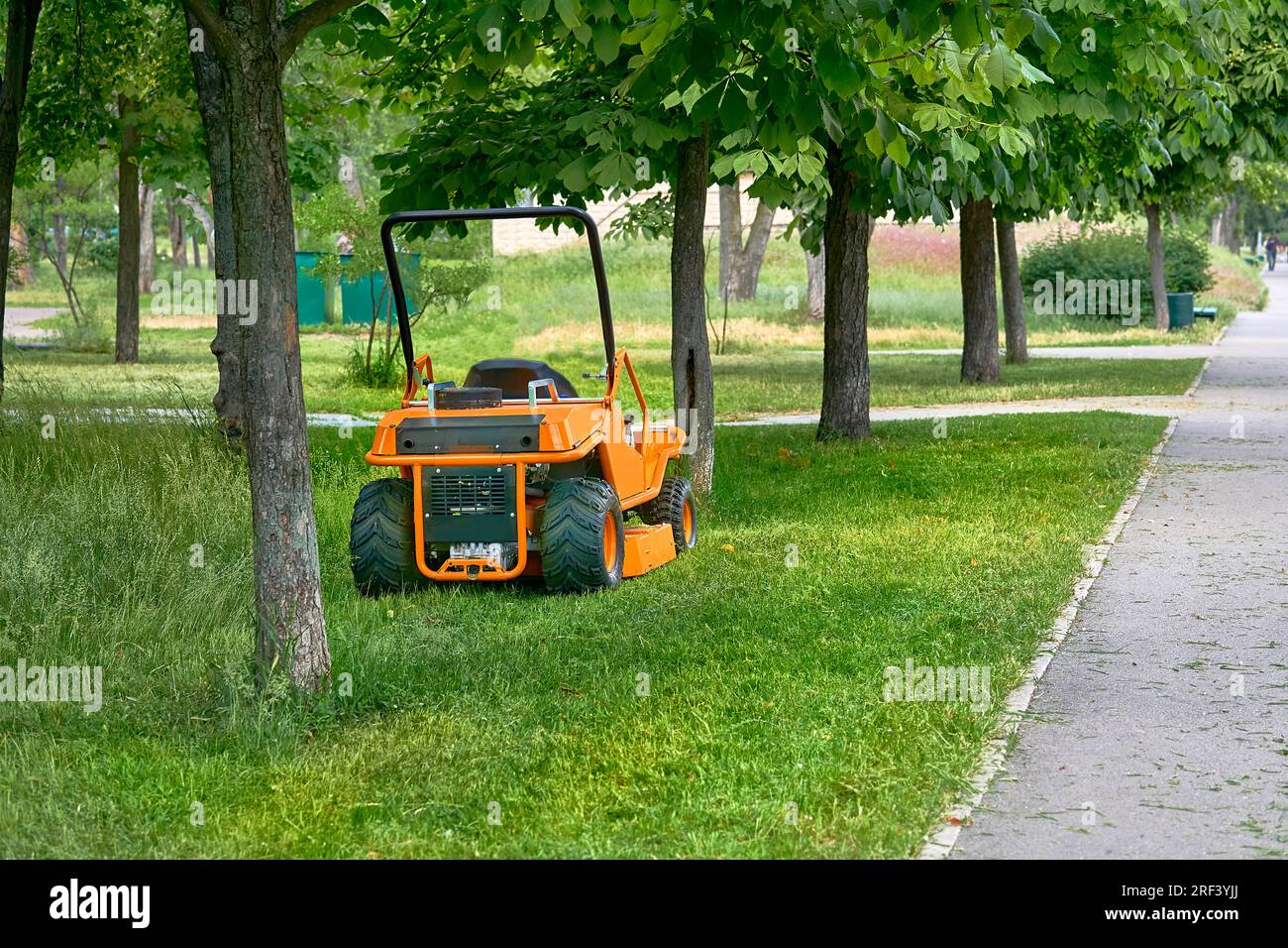 Professional grass cutting on lawns with a mini tractor lawn mower ...